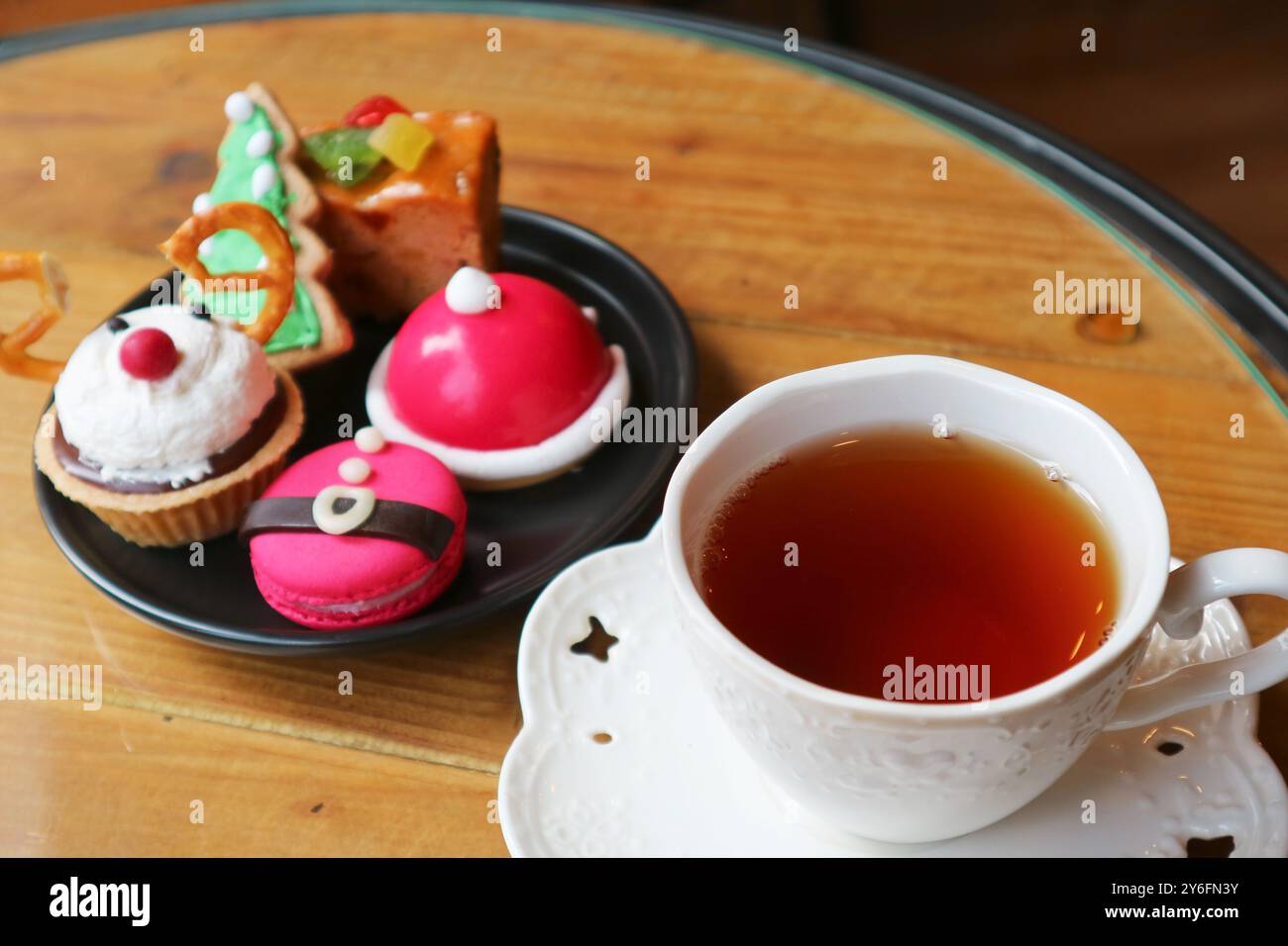 Cup of Hot Tea with Blurry Christmas Afternoon Tea Pastries in the ...