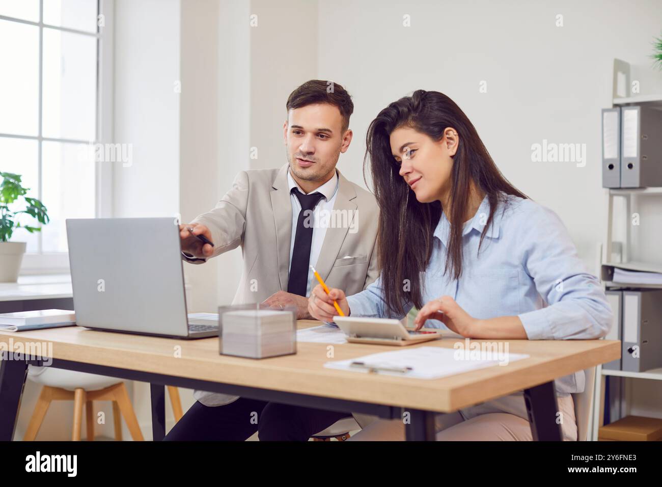 Serious business people at table busy doing office expenses management ...