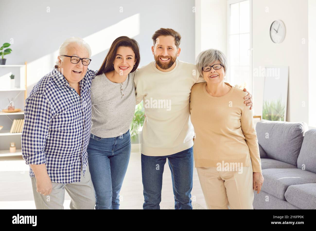 Happy family group portrait, smiling aging parents and adult children ...