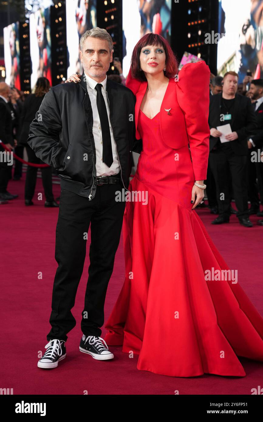 Joaquin Phoenix, left, and Lady Gaga pose for photographers upon ...