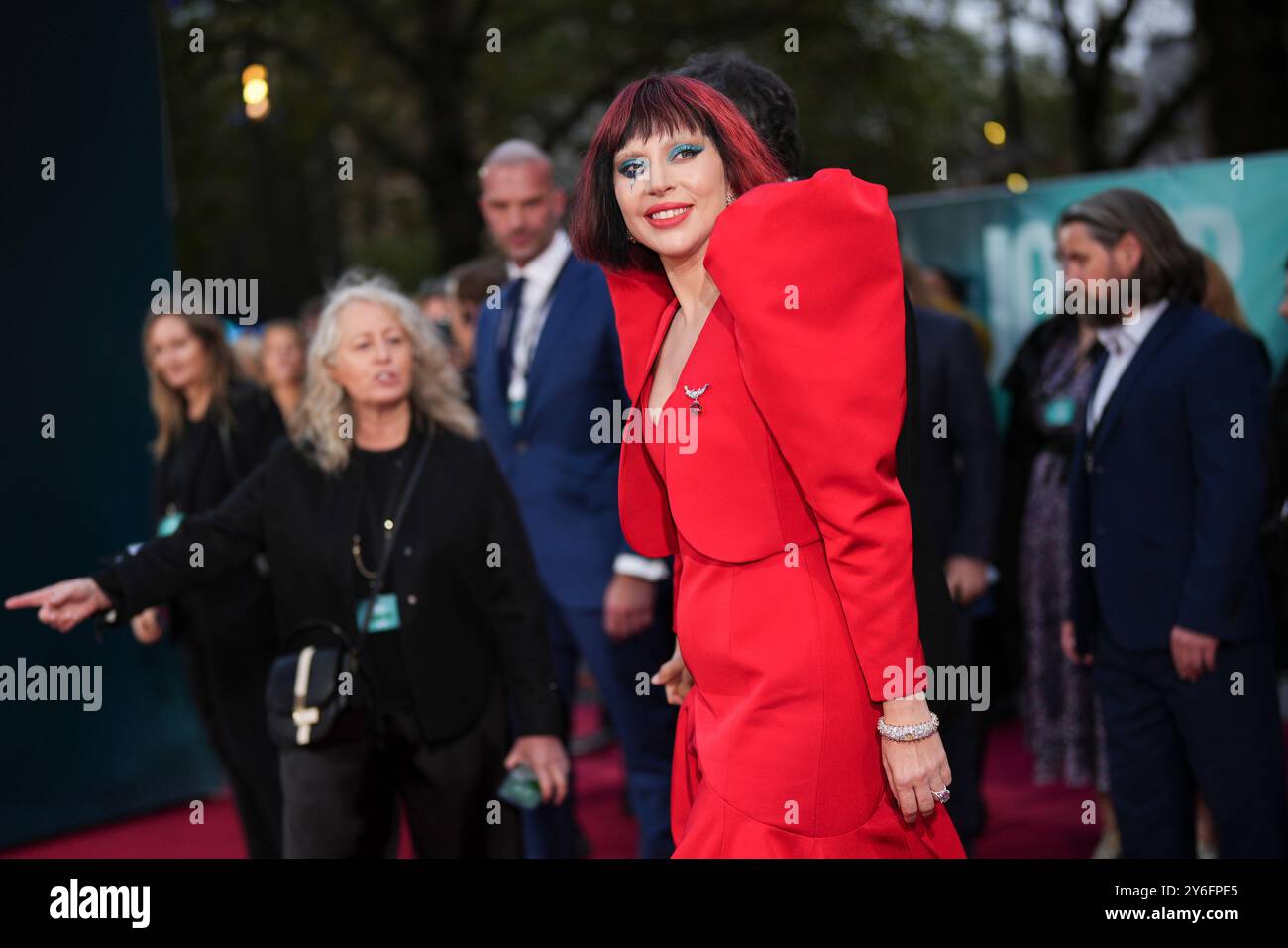Lady Gaga poses for photographers upon arrival at the premiere for the ...