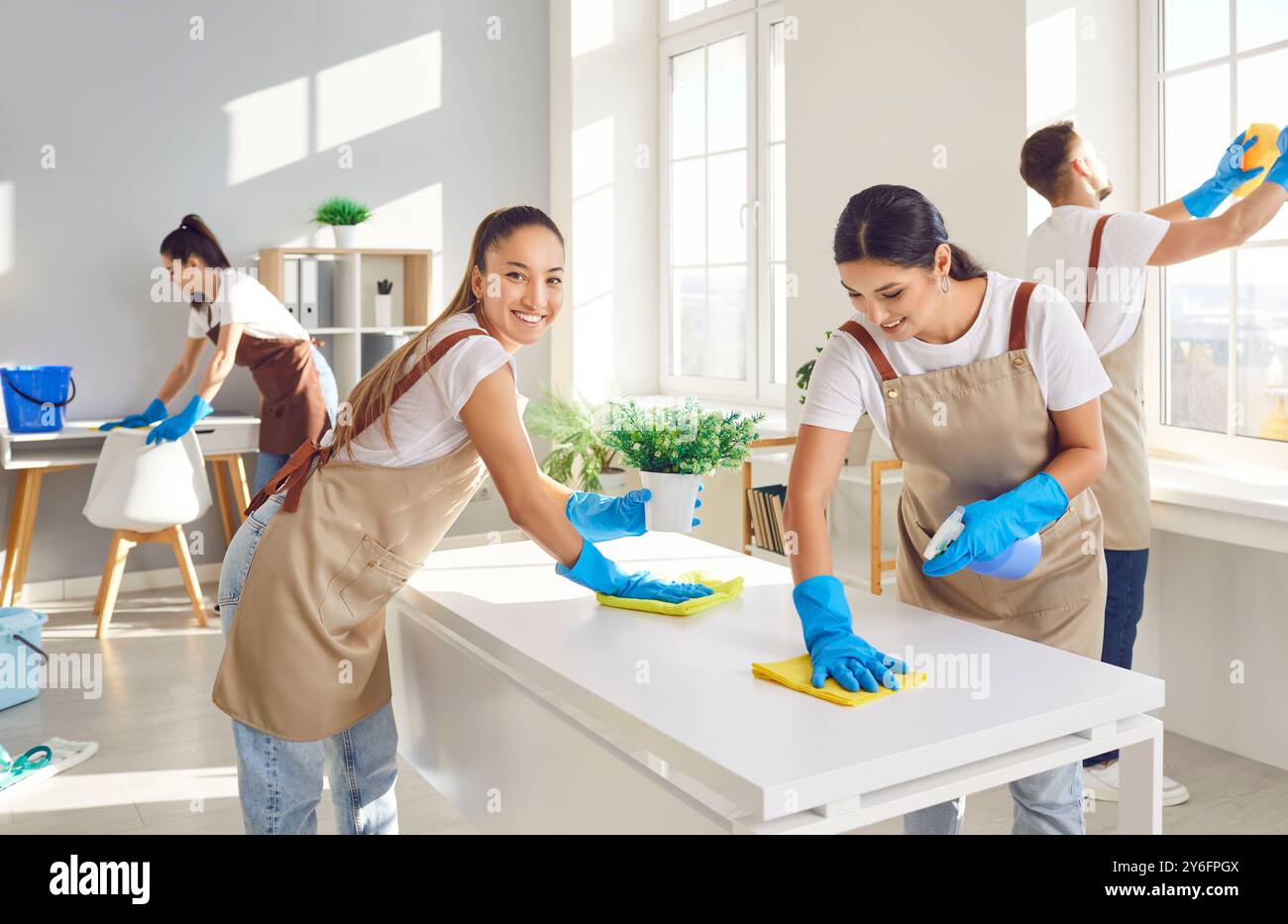 Cleaning company two women smiling posing for camera. Professional ...