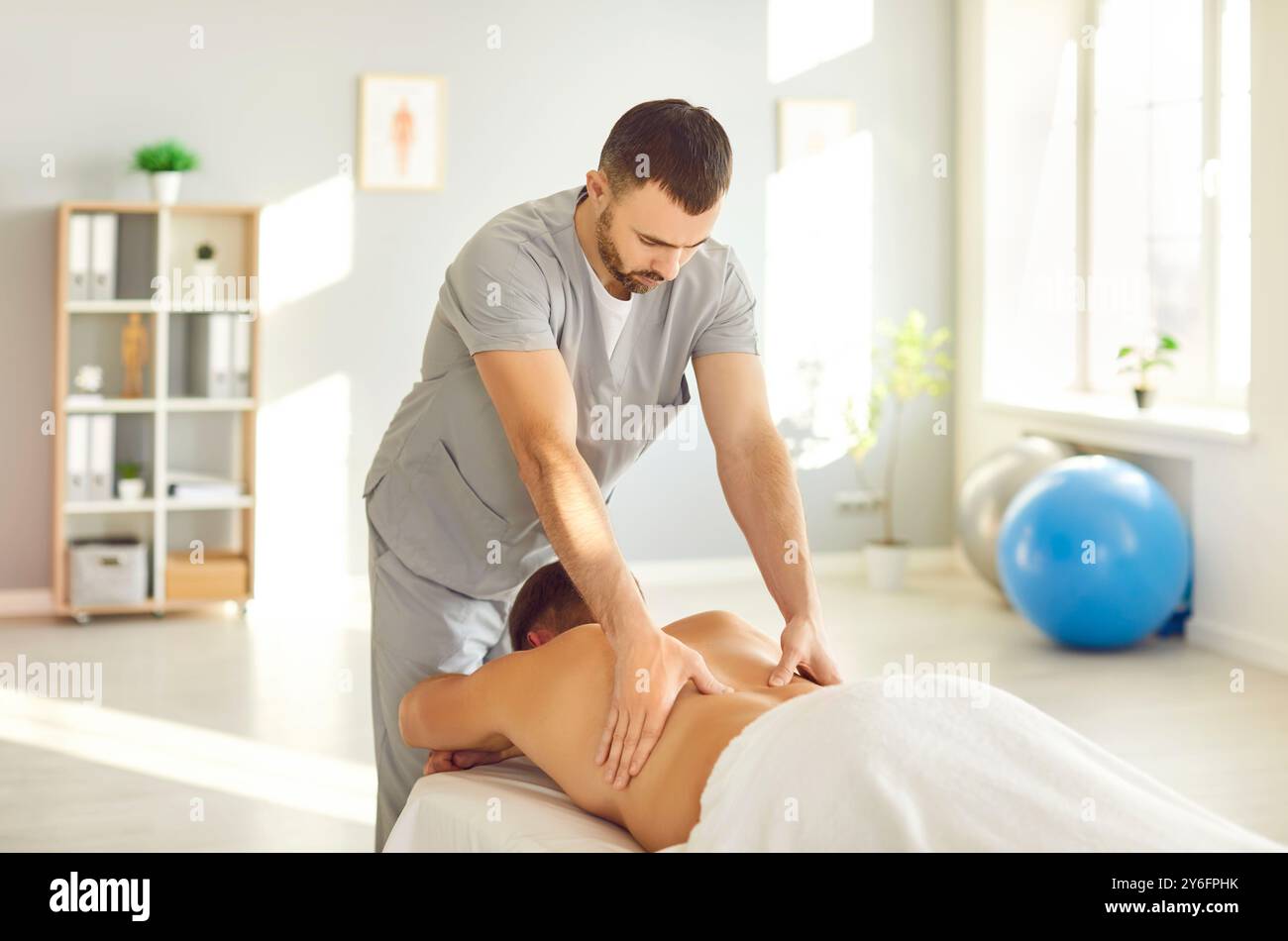 Manual therapy session, body relaxing back massage by physical ...