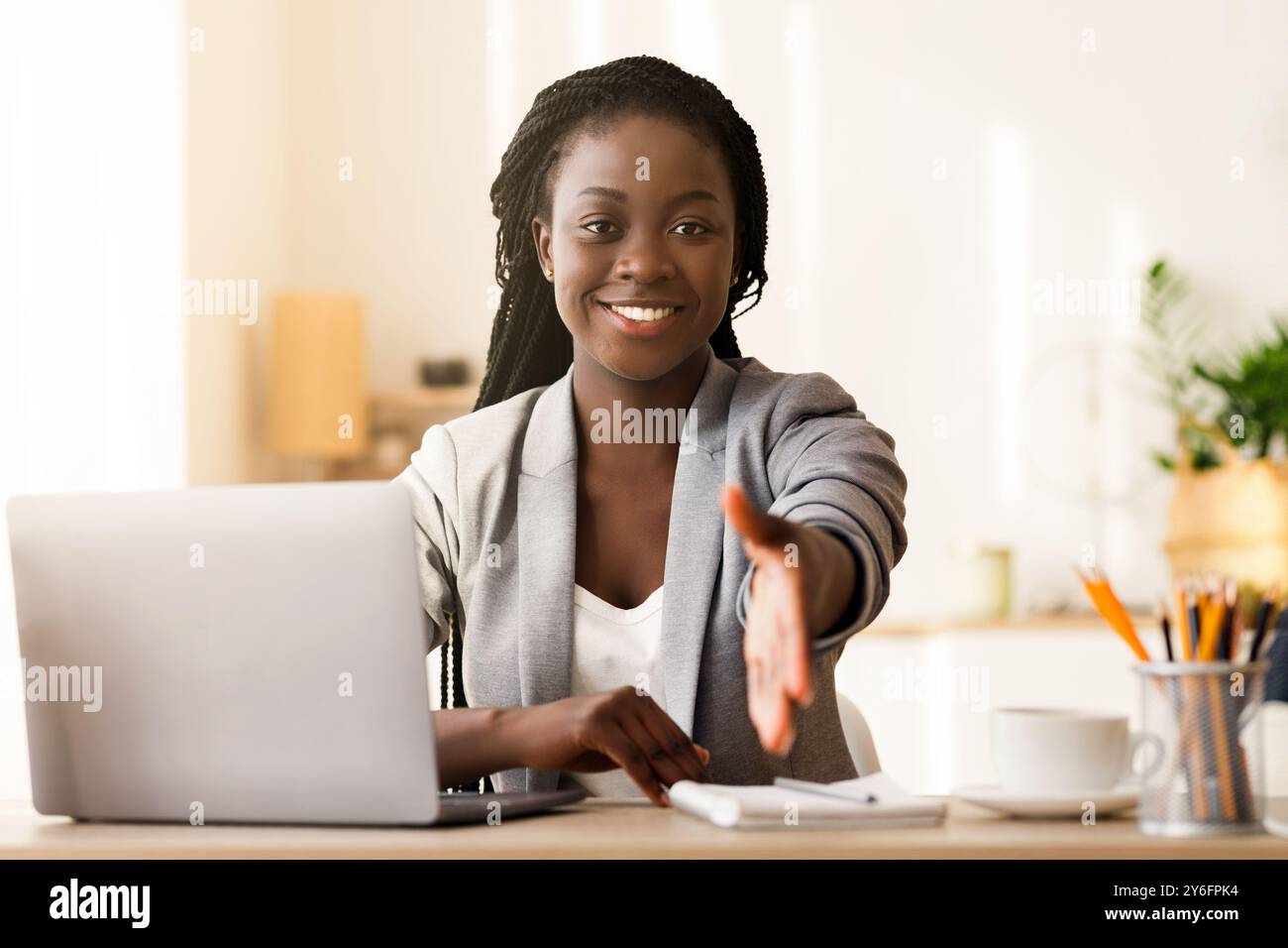 Female HR manager extending hand for handshake after successful job ...
