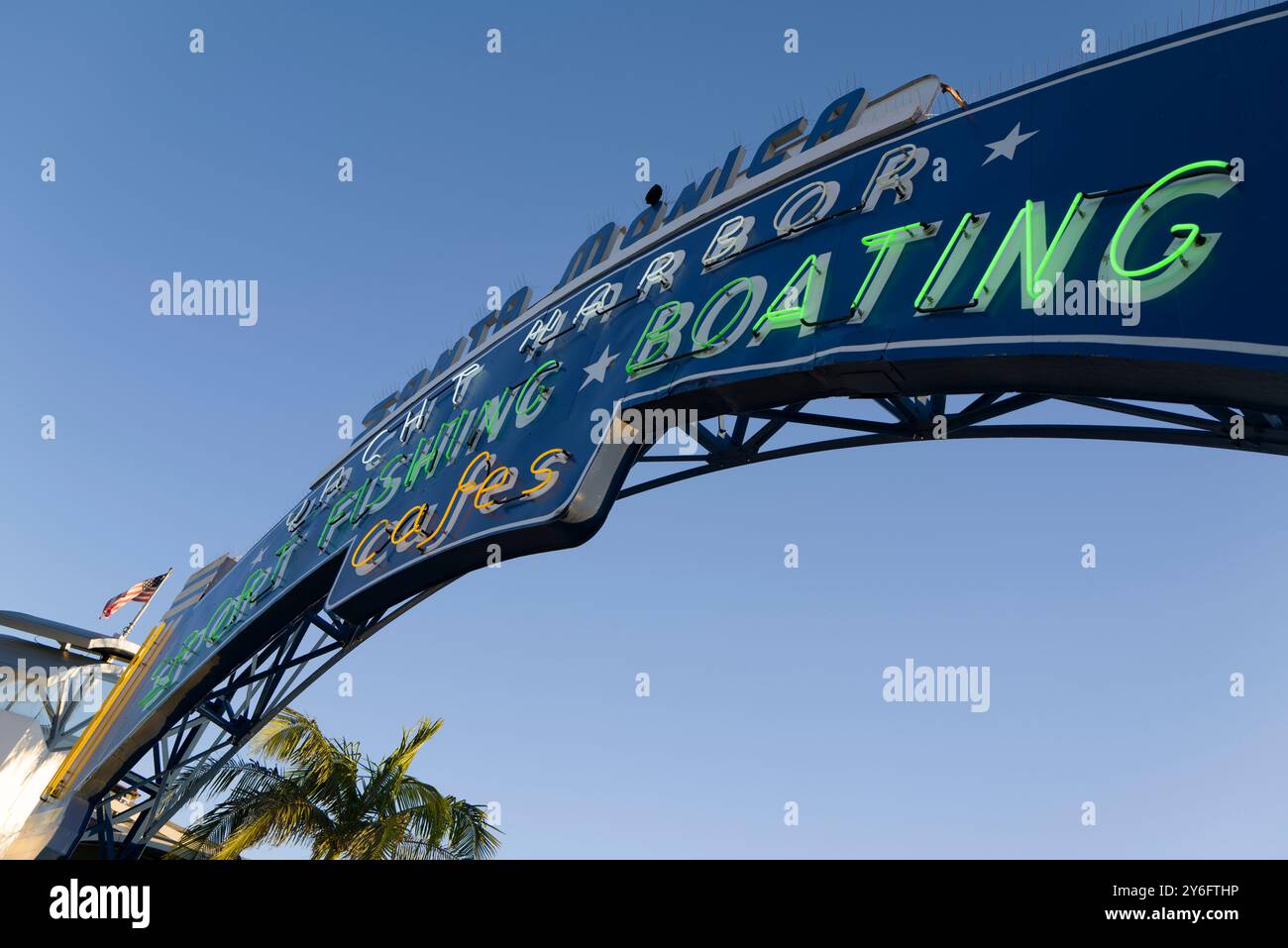 Crowds gather under the Santa Monica Yacht Harbor sign, enjoying a day ...