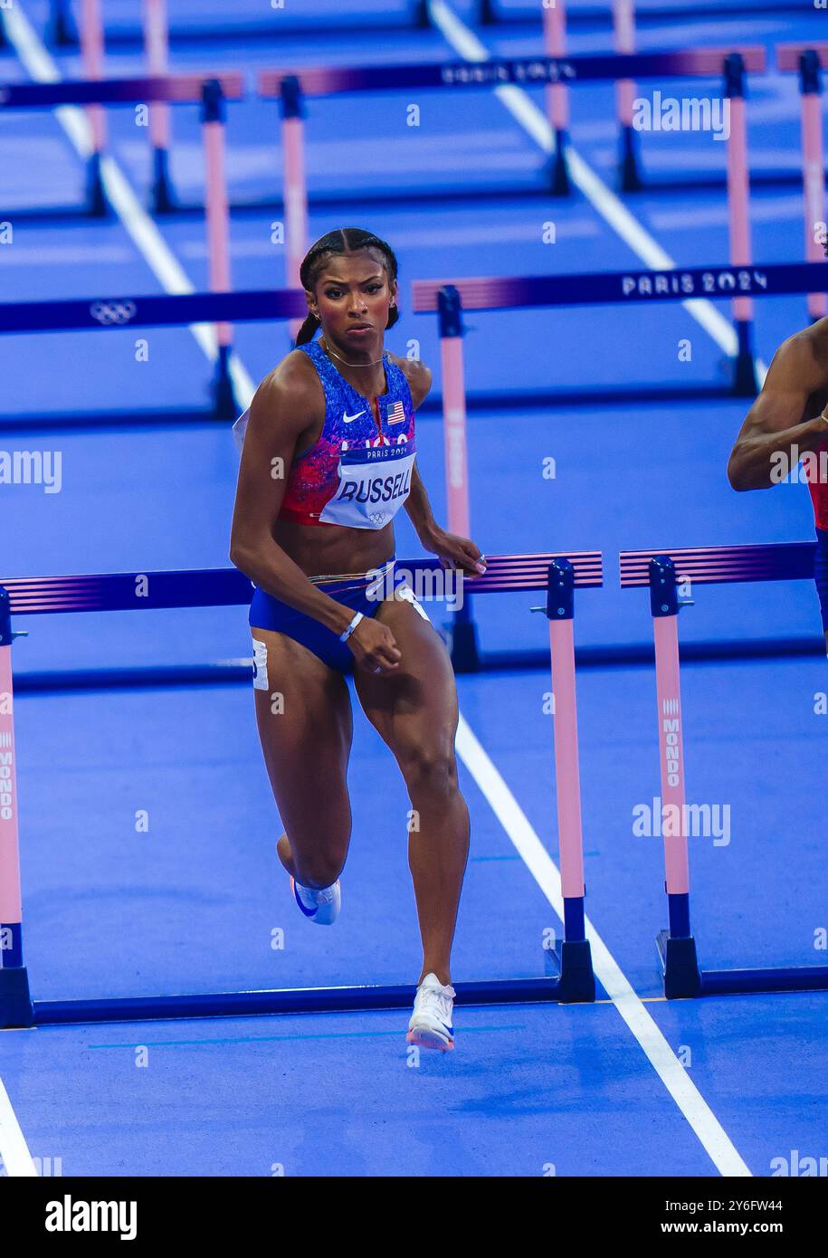 Masai Russell participating in the 100 meters hurdles at the Paris 2024 ...