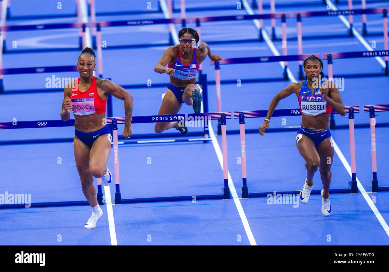 Jasmine Camacho-Quinn and Masai Russell participating in the 100 meters ...