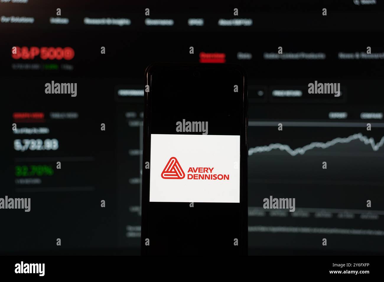 In this photo illustration, the avery dennison logo is displayed on a ...