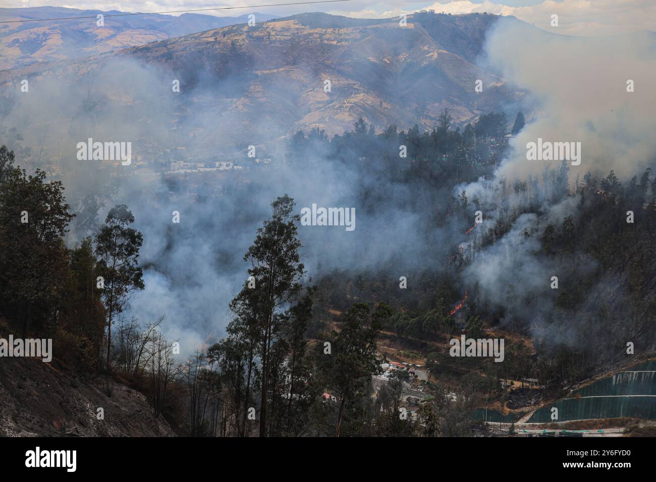 Quito, Ecuador. 25th Sep, 2024. Smoke rises from the forest during ...