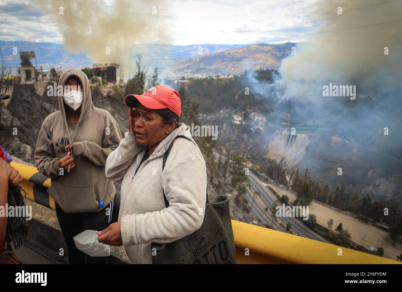 Quito, Ecuador. 25th Sep, 2024. A woman weeps worriedly during severe ...