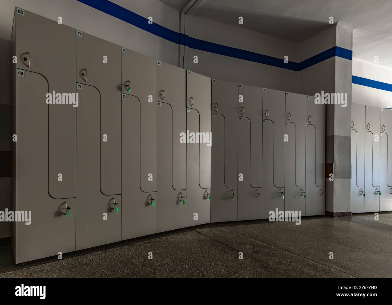 Gray lockers for clothes, lockable shelves, lockers for students at ...