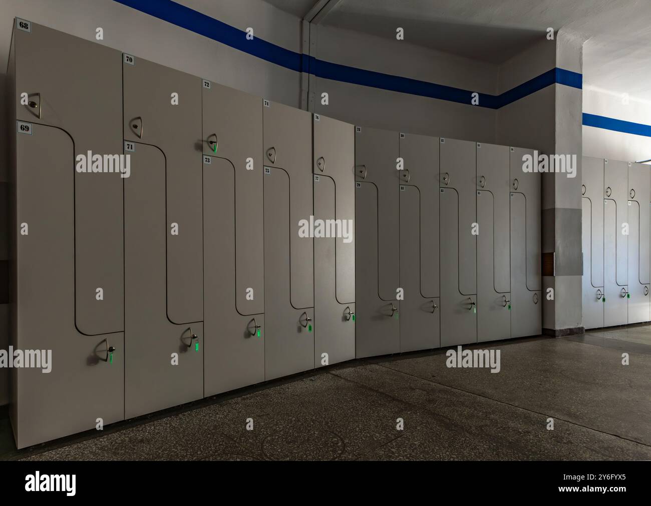 Gray lockers for clothes, lockable shelves, lockers for students at ...