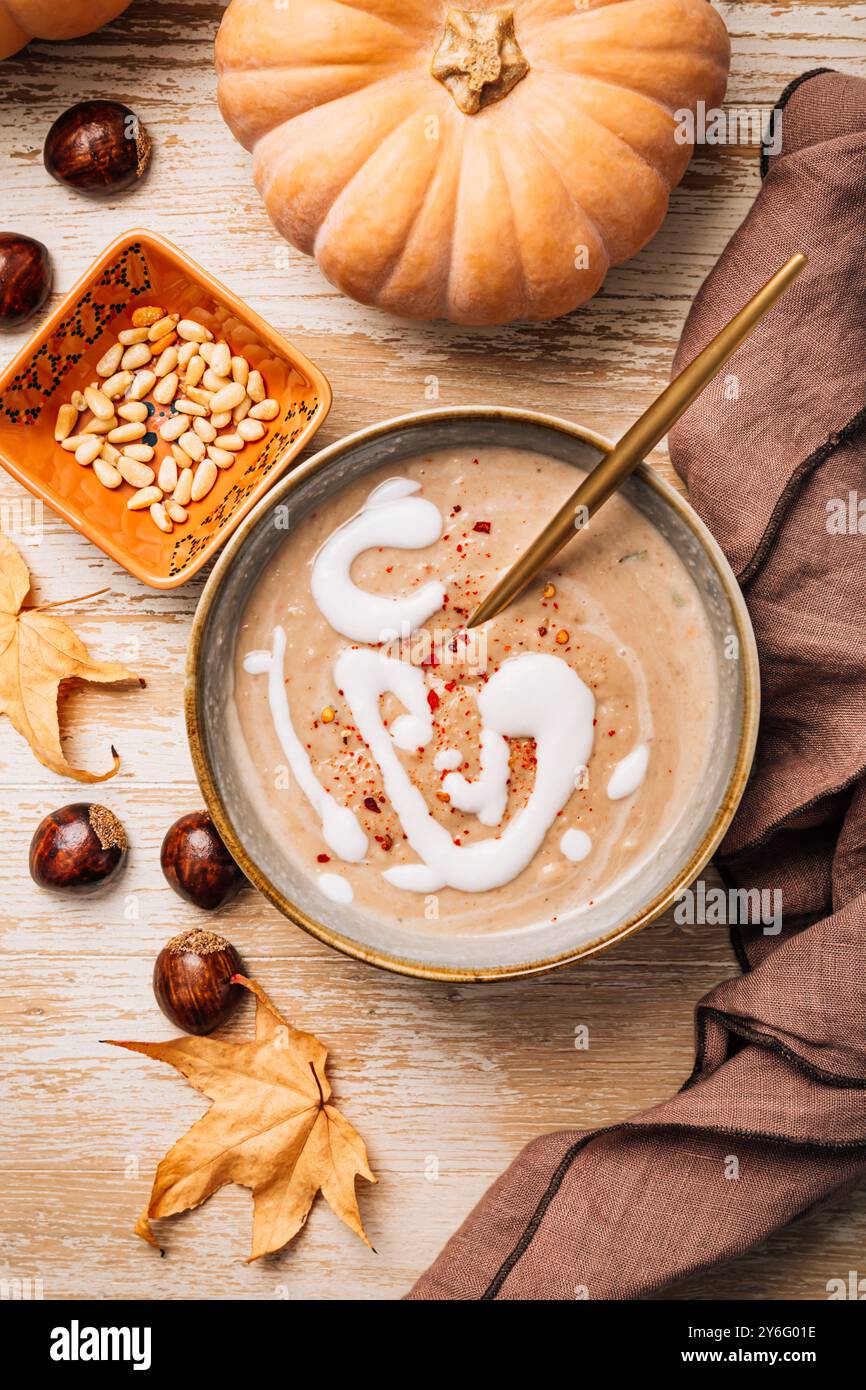 Creamy sweet chestnuts and pumpkin soup with seeds and cream Stock ...
