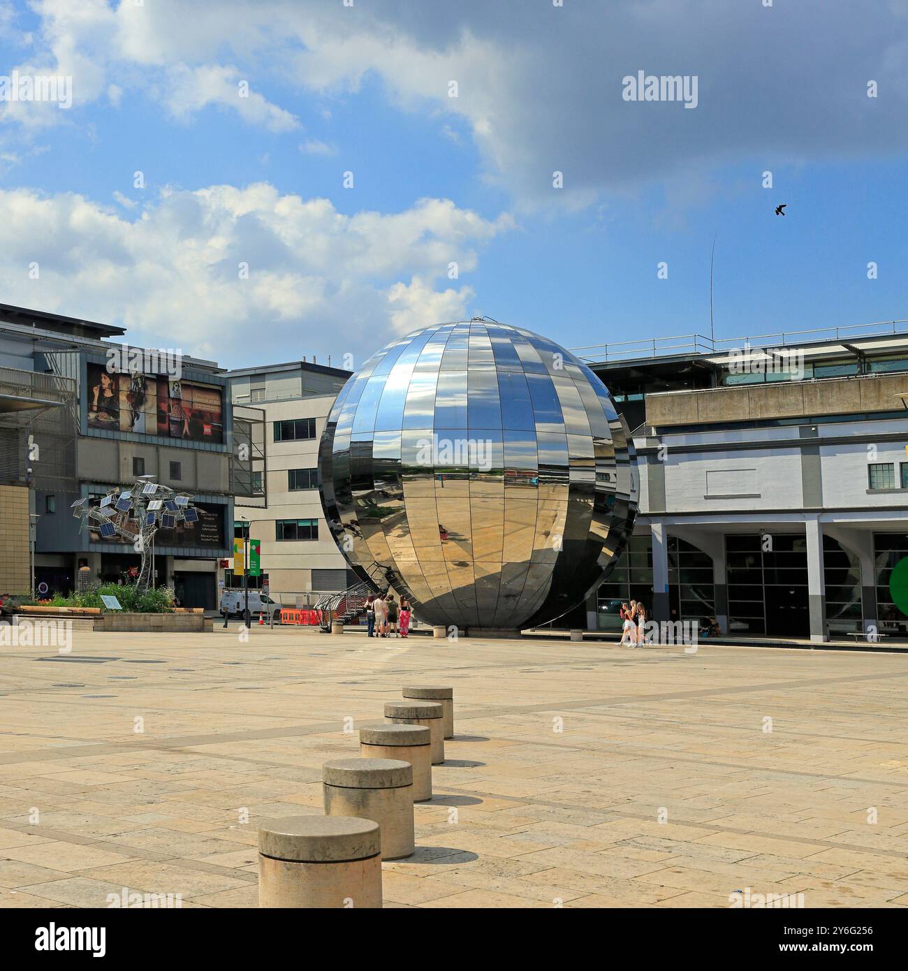 The Millennium Sphere reflecting blue sky and fluffy clouds in ...