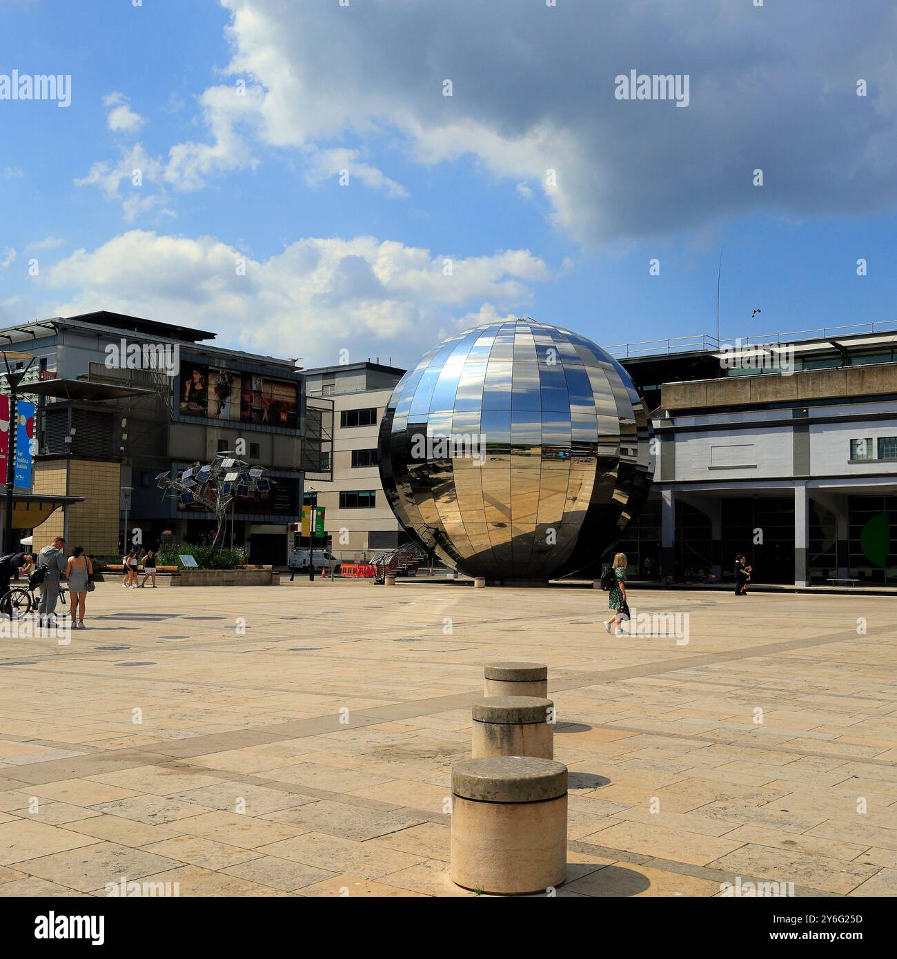 The Millennium Sphere reflecting blue sky and fluffy clouds in ...