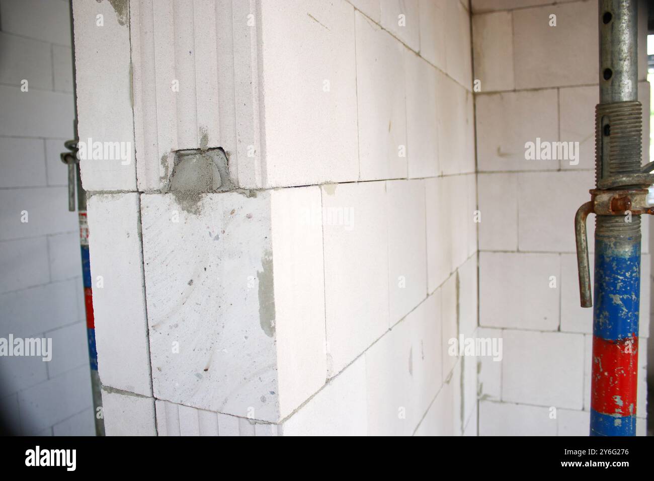 Inside view of a new building with white stone walls concrete and ...