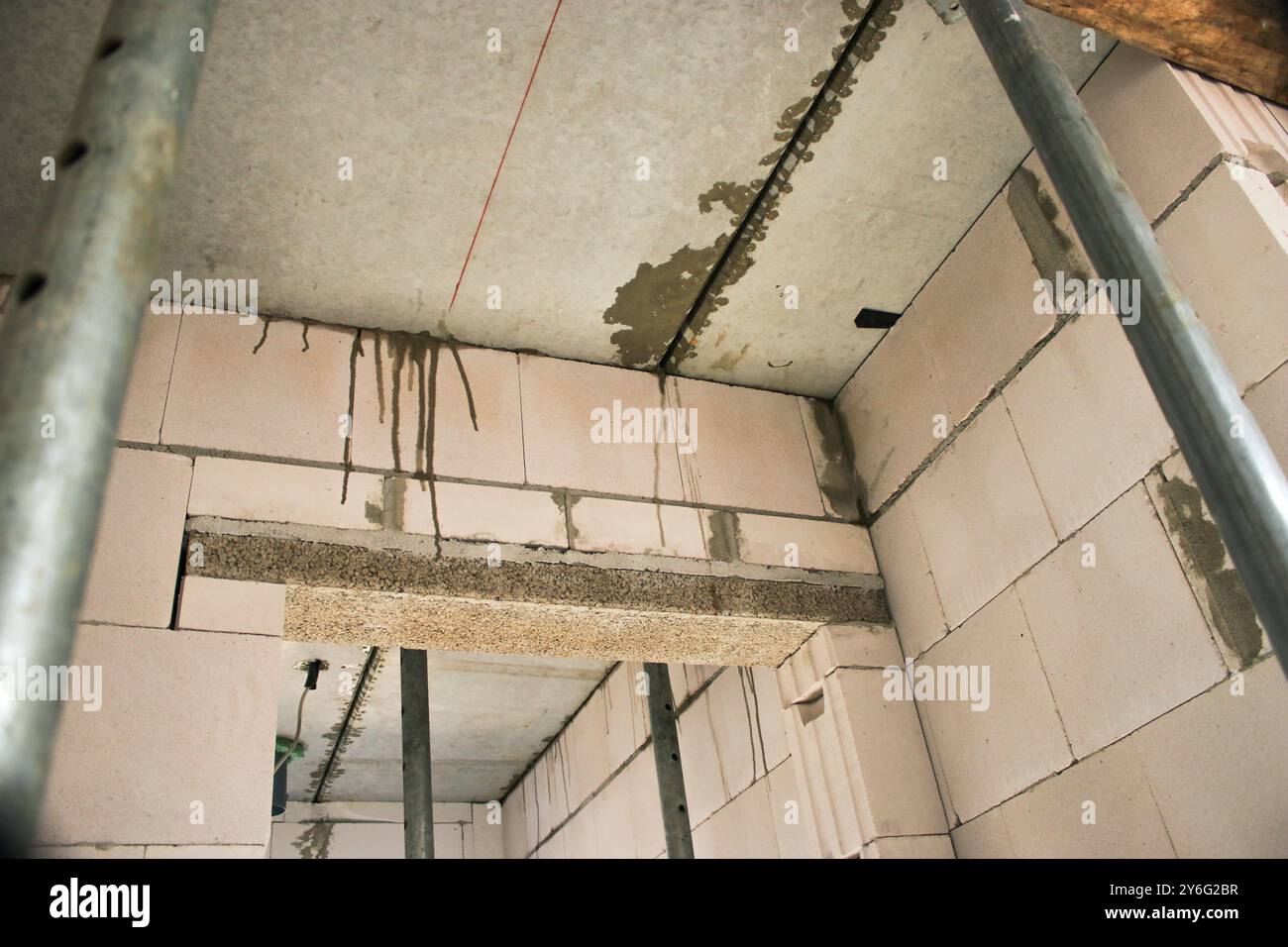 Inside view of a new building with white stone walls concrete and ...