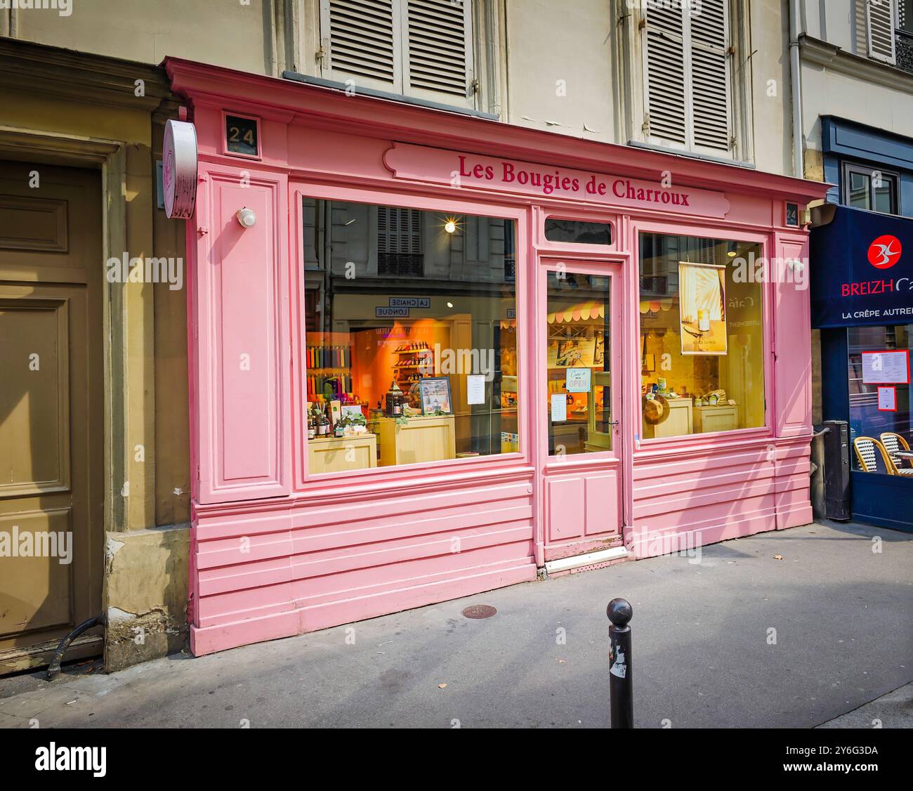 09 25 2024 - Paris, France. Exterior facade of a Parisian shop window ...