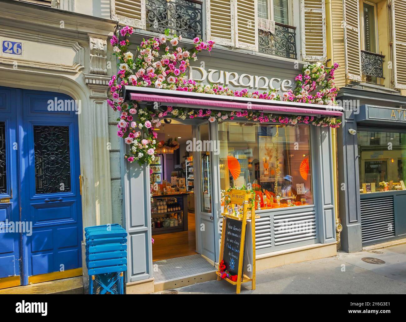09 25 2024 - Paris, France. Exterior facade of a Parisian shop window ...