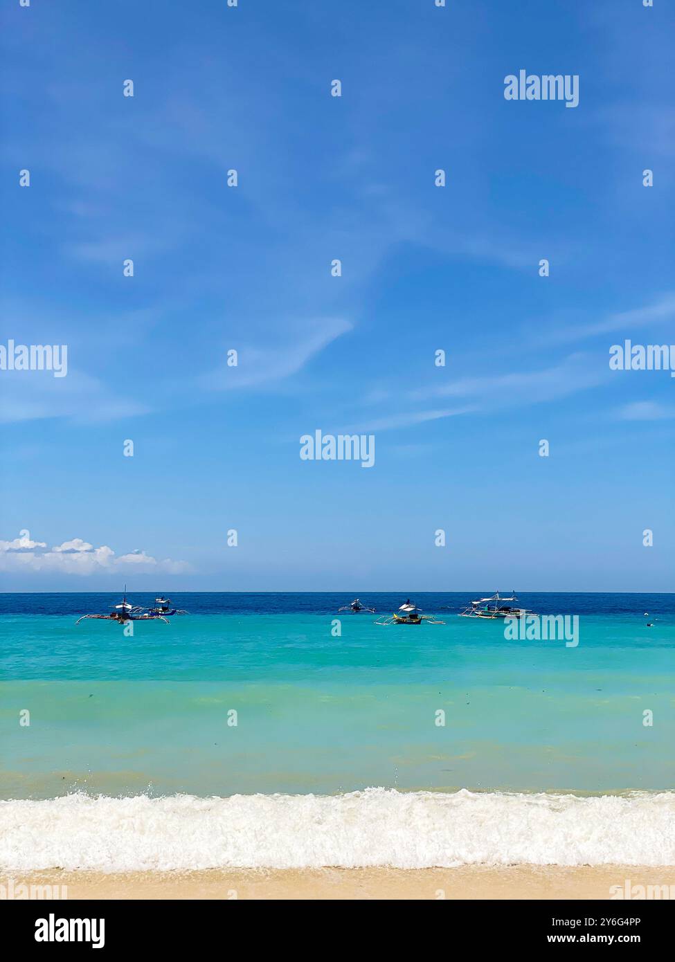 Fishing boats over the sea surface. Ocean waves on beach resort. Samal ...