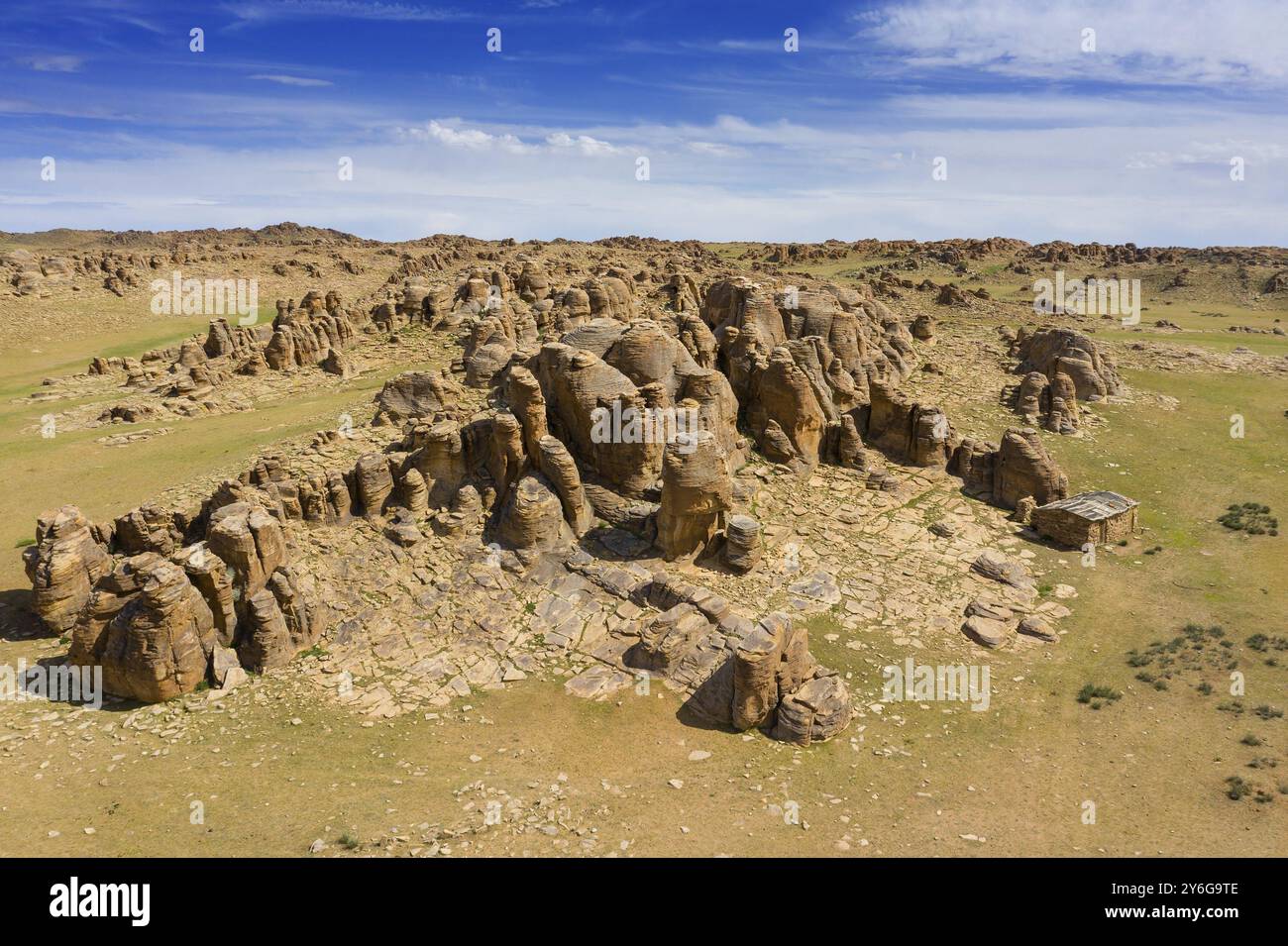 Aerial view at rock formations and stacked stones on granite hilltops ...