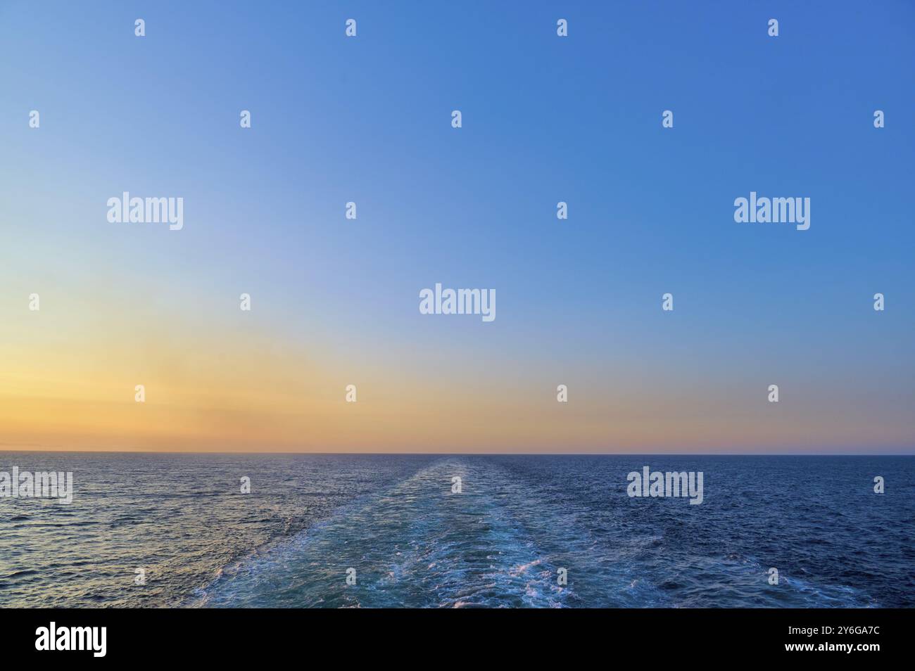 View from the cruise ship at sunset at the stern of the ship onto the ...