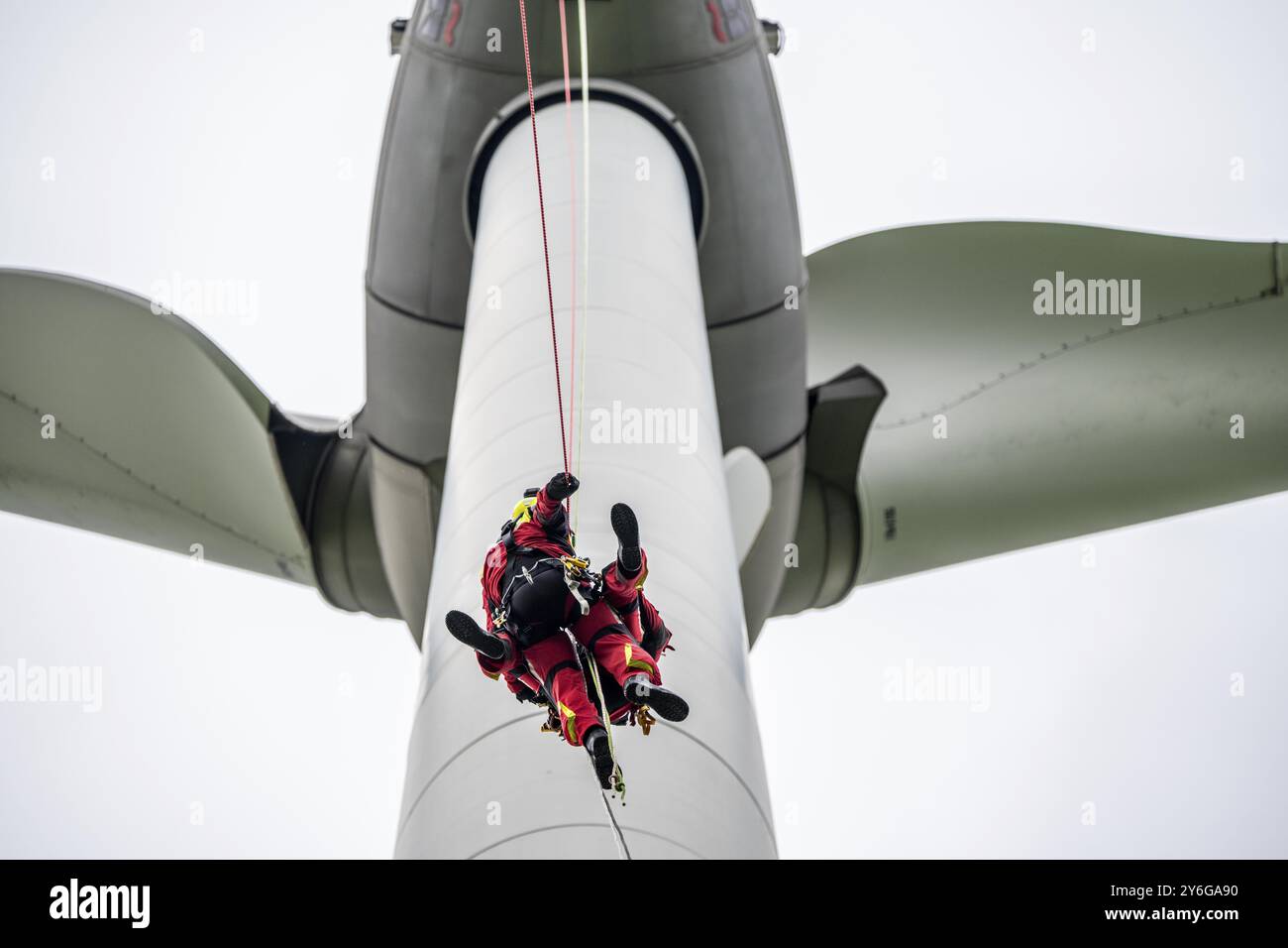 Height rescuers from the Gelsenkirchen fire brigade practise abseiling ...