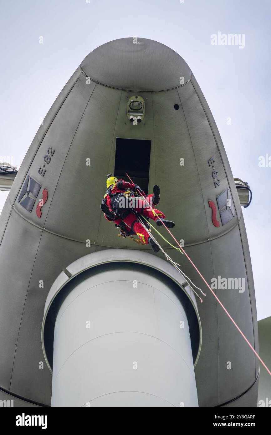 Height rescuers from the Gelsenkirchen fire brigade practise abseiling ...