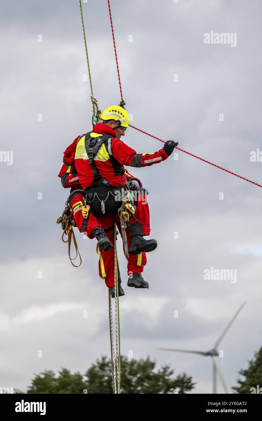 Height rescuers from the Gelsenkirchen fire brigade practise abseiling ...