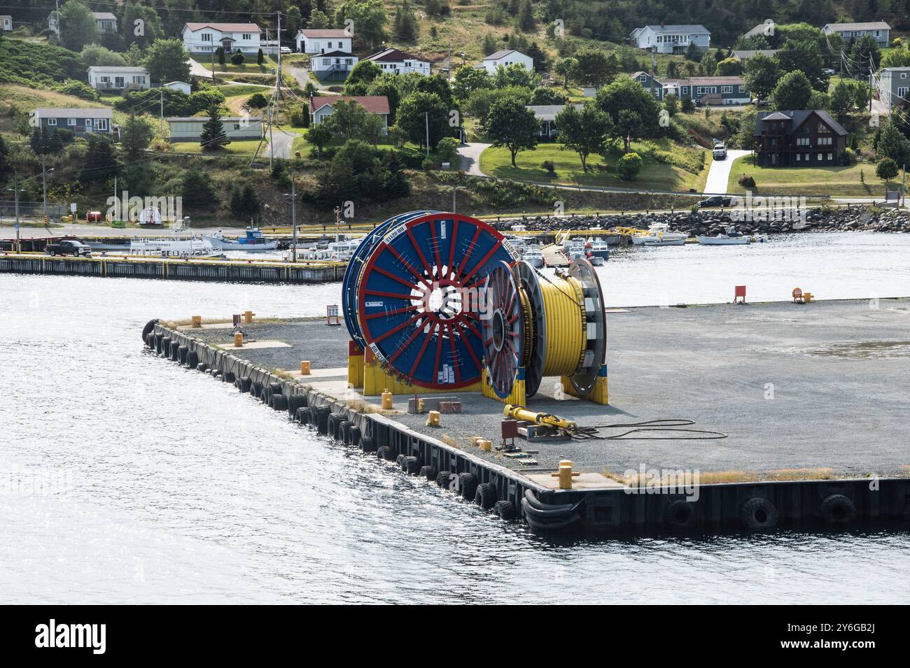 Large spool of yellow cable on the dock in Bay Bulls, Newfoundland ...