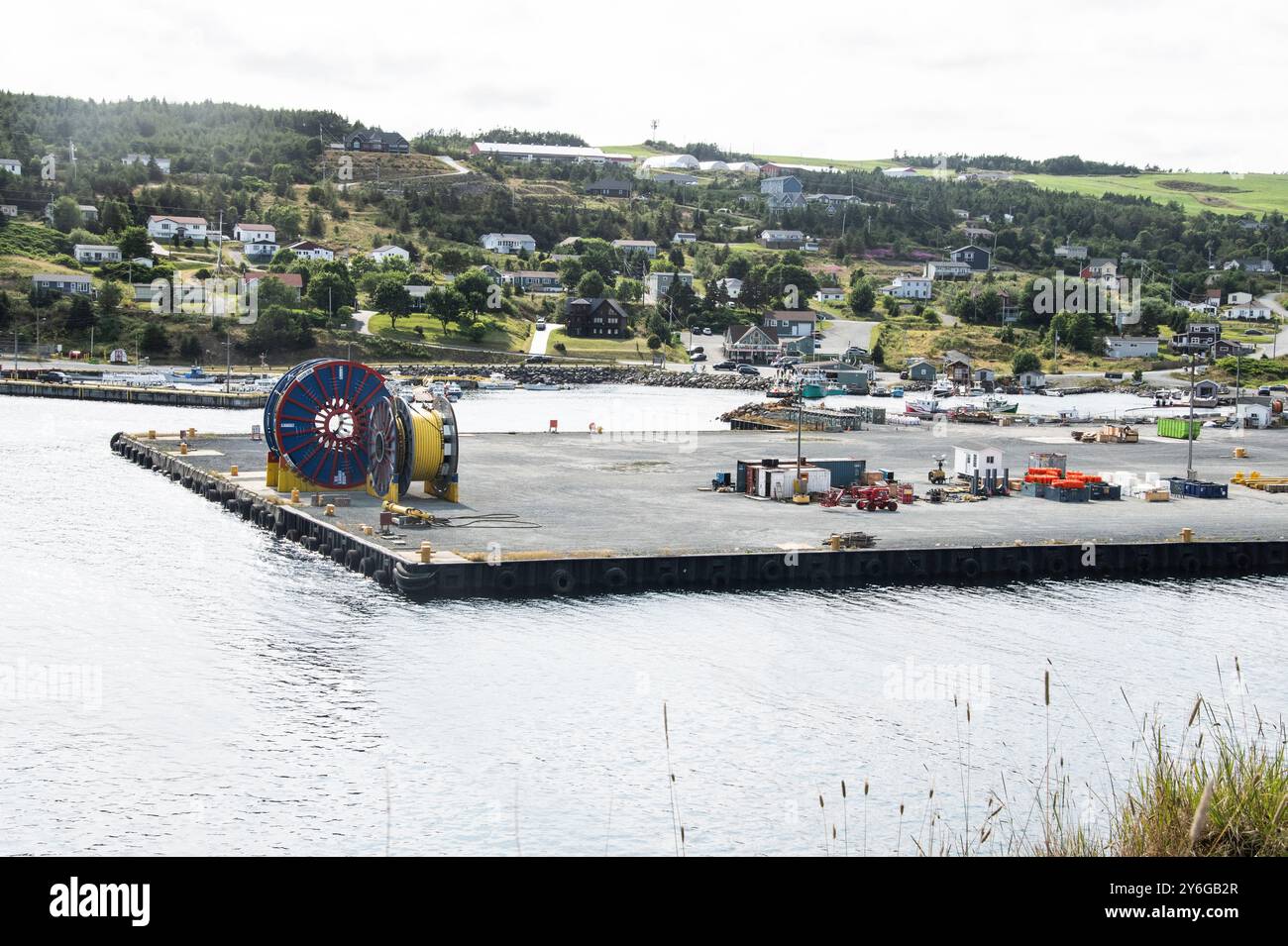 Large spool of yellow cable on the dock in Bay Bulls, Newfoundland ...