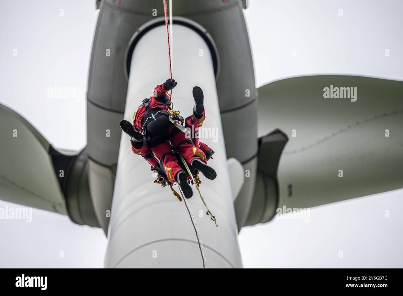 Height rescuers from the Gelsenkirchen fire brigade practise abseiling ...