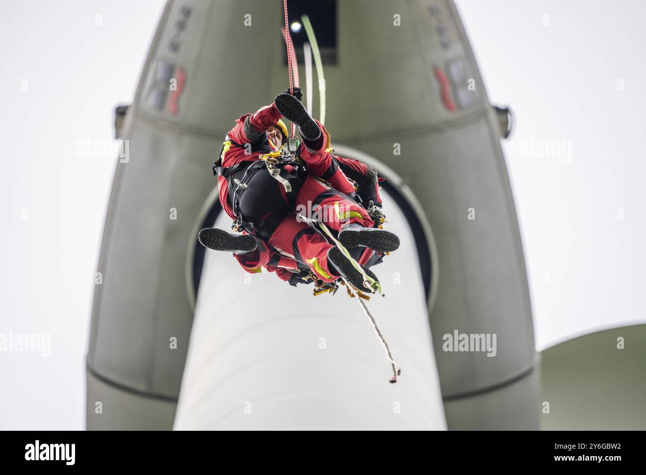 Height rescuers from the Gelsenkirchen fire brigade practise abseiling ...