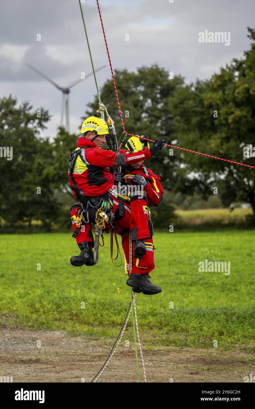 Height rescuers from the Gelsenkirchen fire brigade practise abseiling ...
