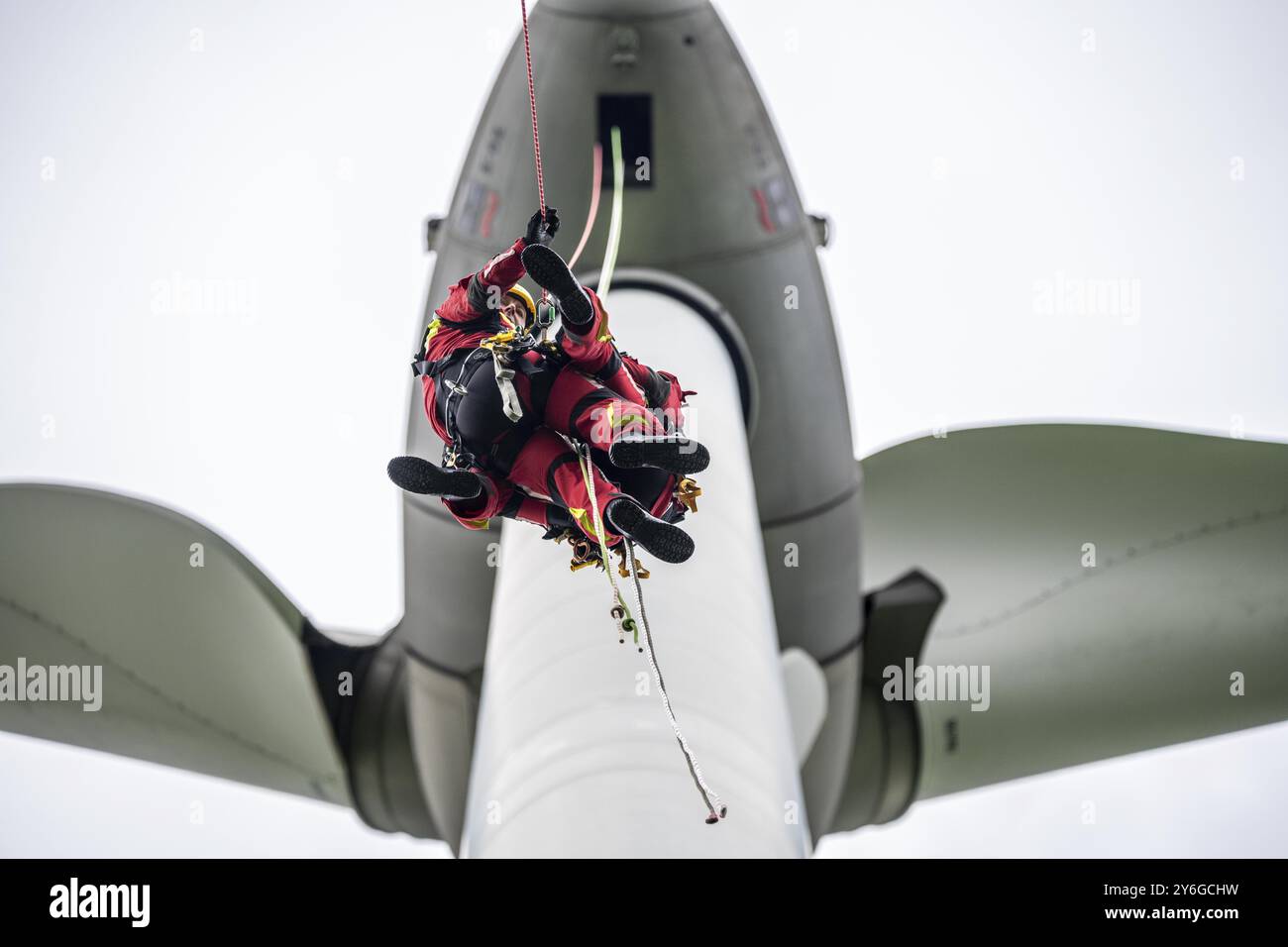 Height rescuers from the Gelsenkirchen fire brigade practise abseiling ...