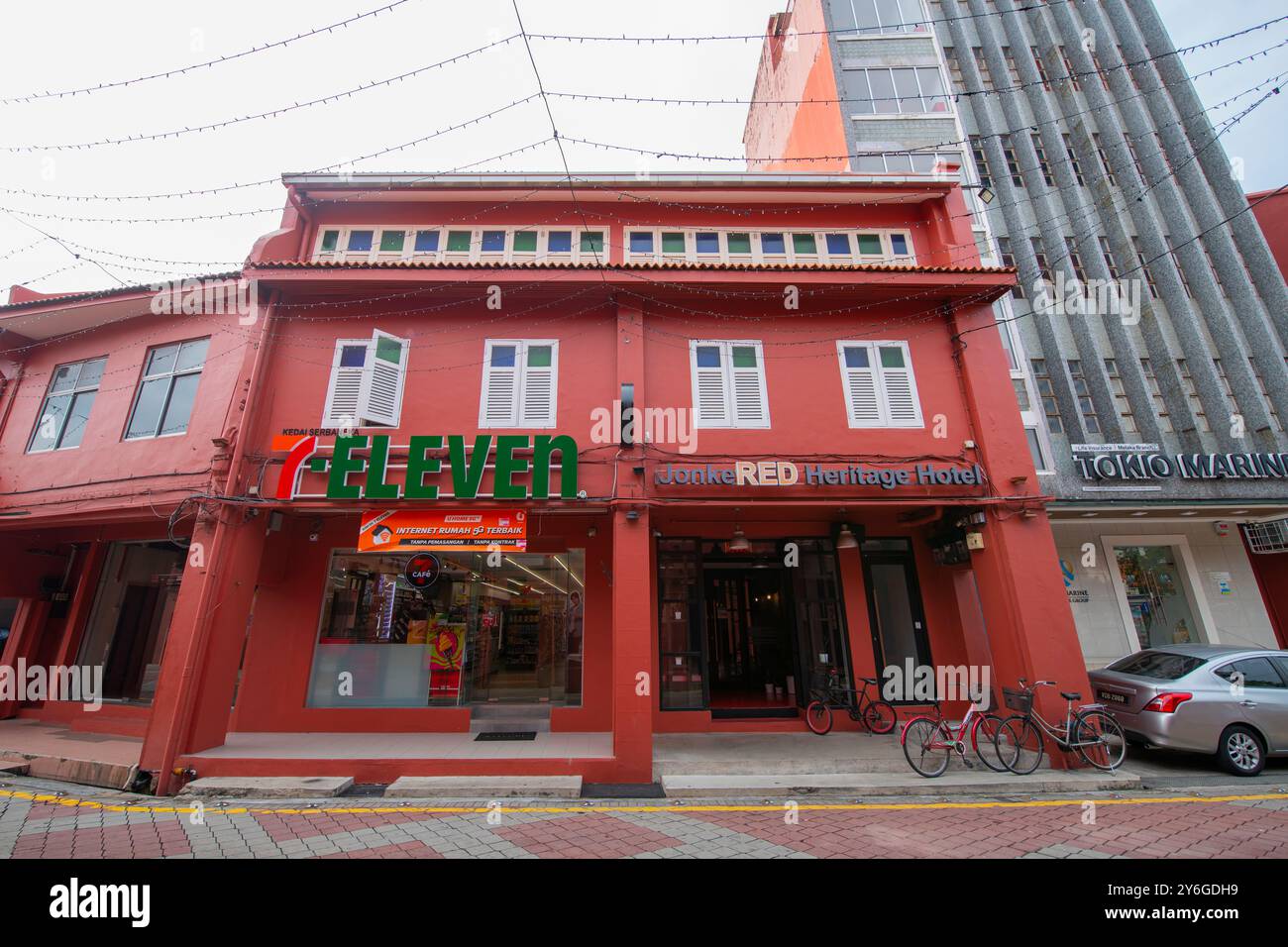 Historic red style house on Jalan Gereja Street at Dutch Square in city ...