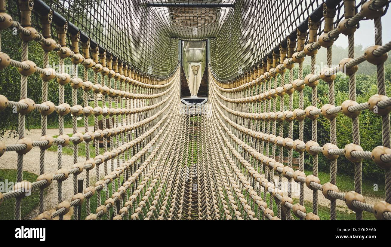 Suspension bridge with rope and mesh nett on a playground for children ...