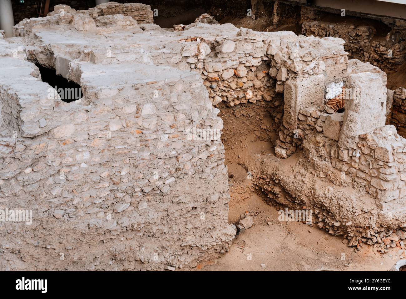 Archaeologists excavate ancient city, stone foundations and remnants of ...