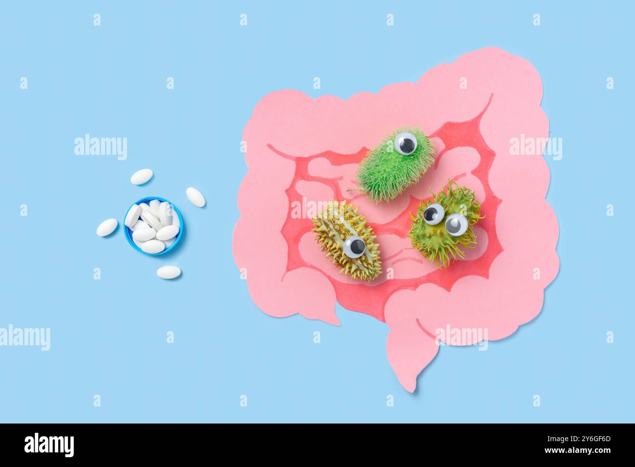 Cartoon intestinal model filled with cartoon bacteria and medicine ...