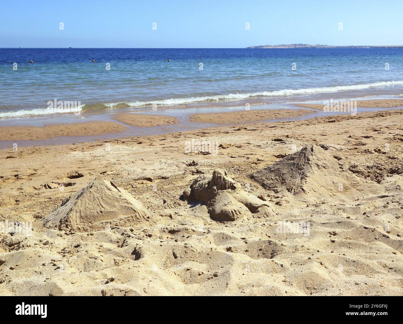 Sand castle on Beach. Egypt pyramids and sphinx from sand Stock Photo ...