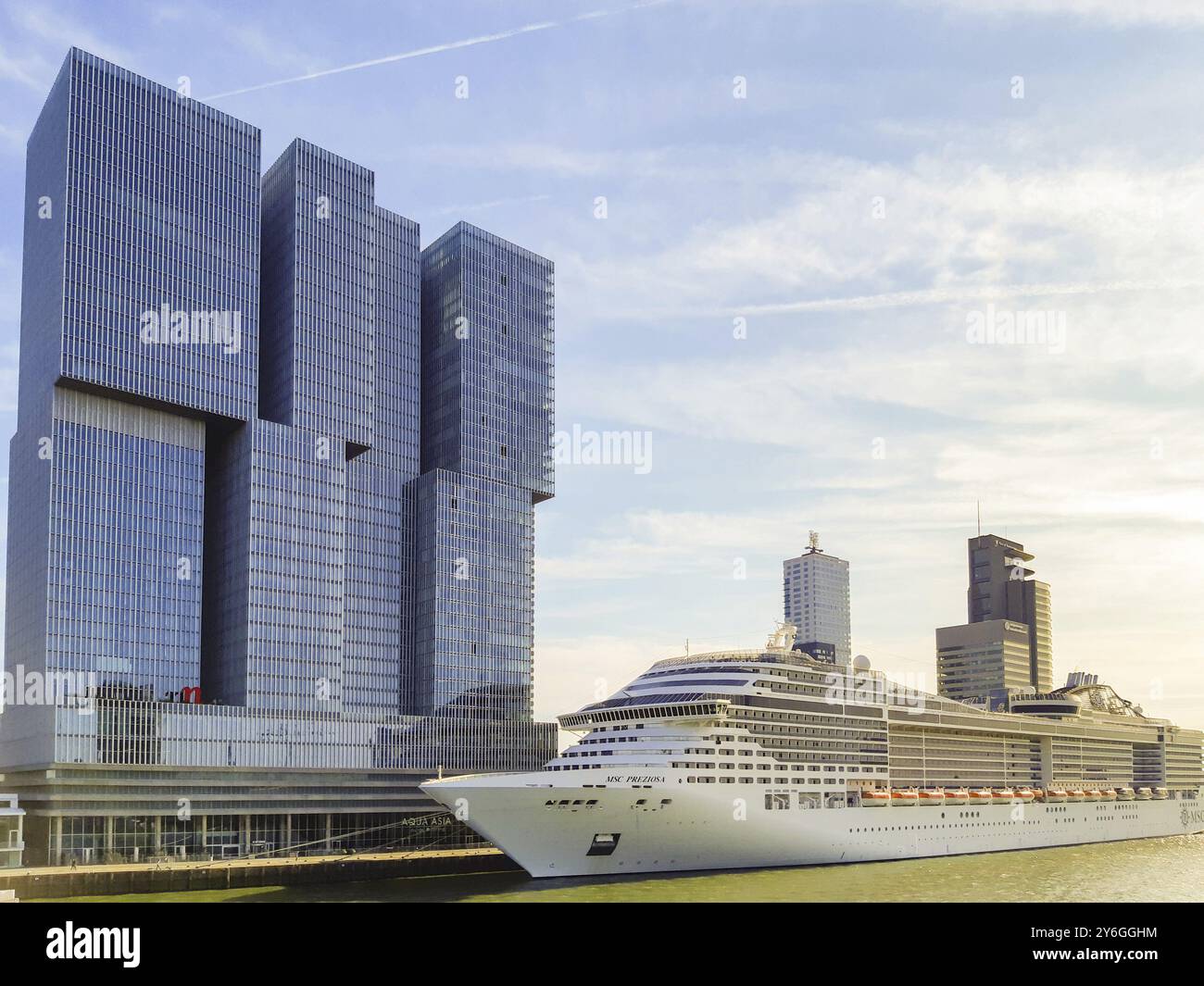 Cruise ship MSC Preziosa at Wilhelminapier with De Rotterdam business ...