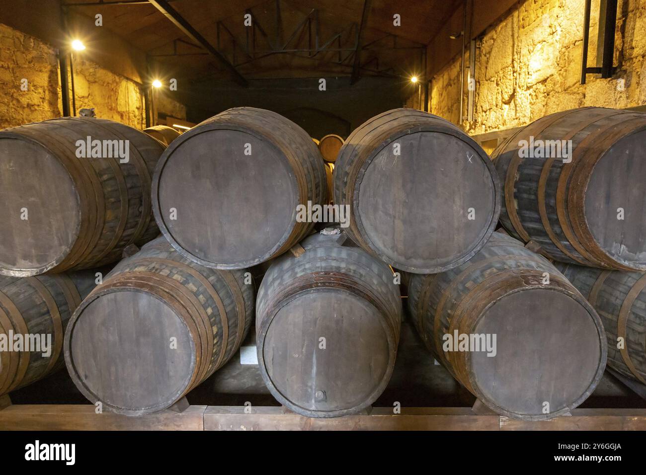 Barrel filled with port wine in a stack in a wine cellar in Porto Stock ...