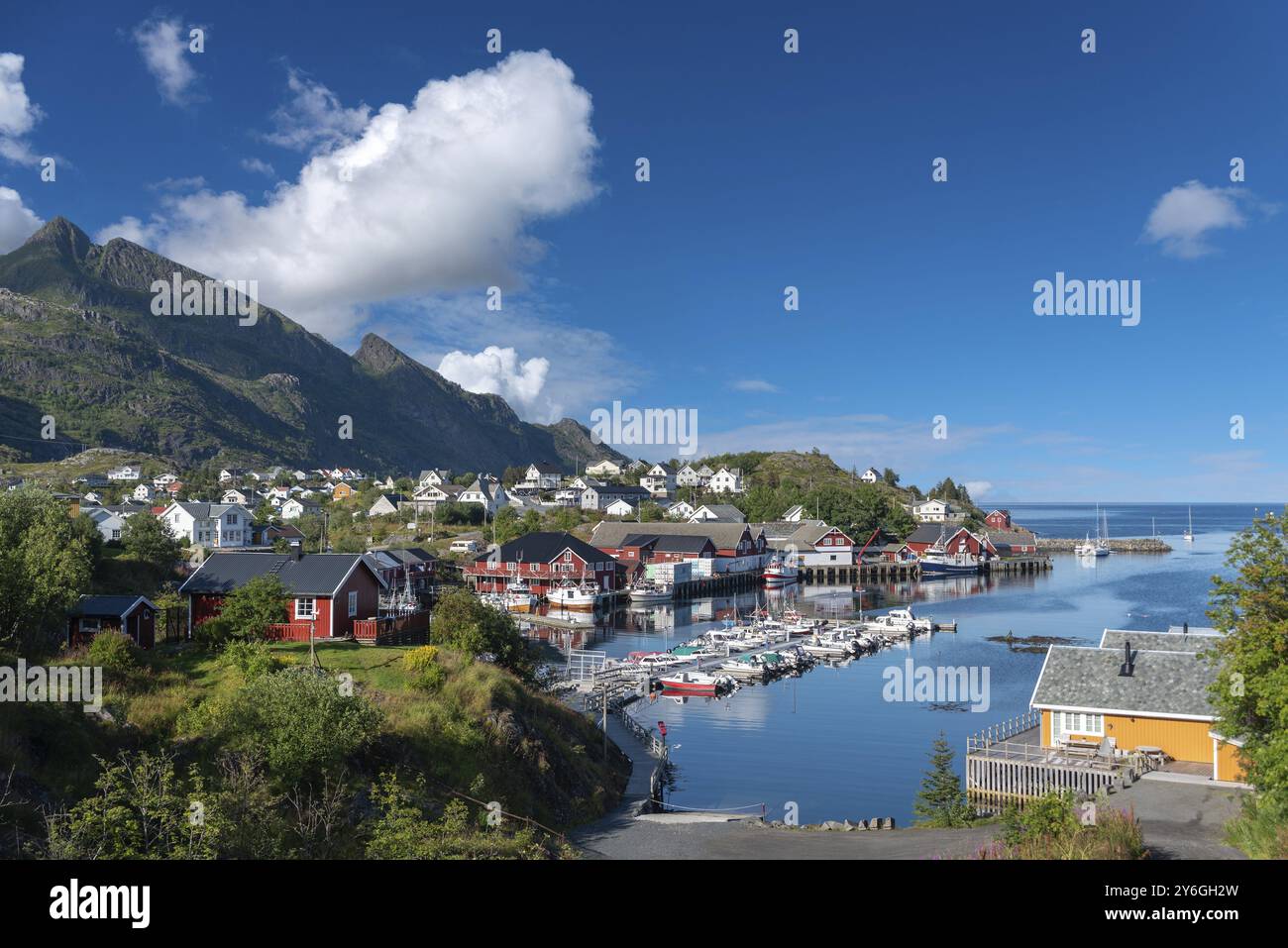 Panoramic view with fishing harbour and surrounding mountain landscape ...