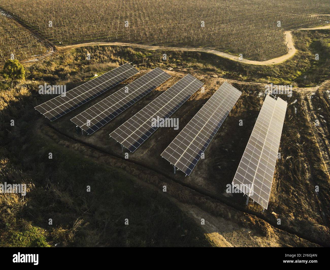 Aerial view of solar power plant solar panels on vineyard. Electric ...