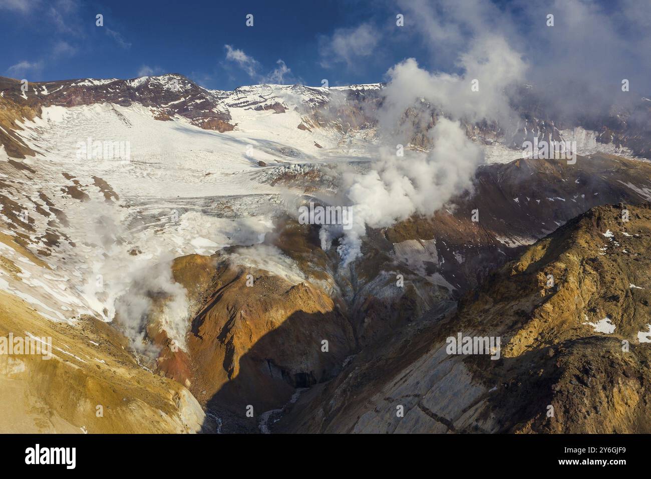 Aerial view of crater with fumaroles of active Mutnovsky volcano ...