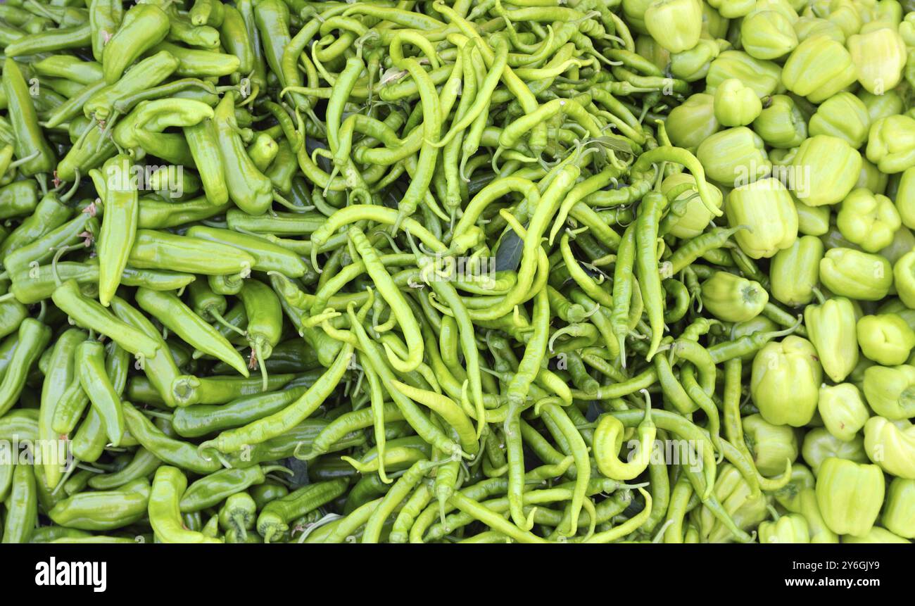 Different varieties of green peppers background Stock Photo - Alamy