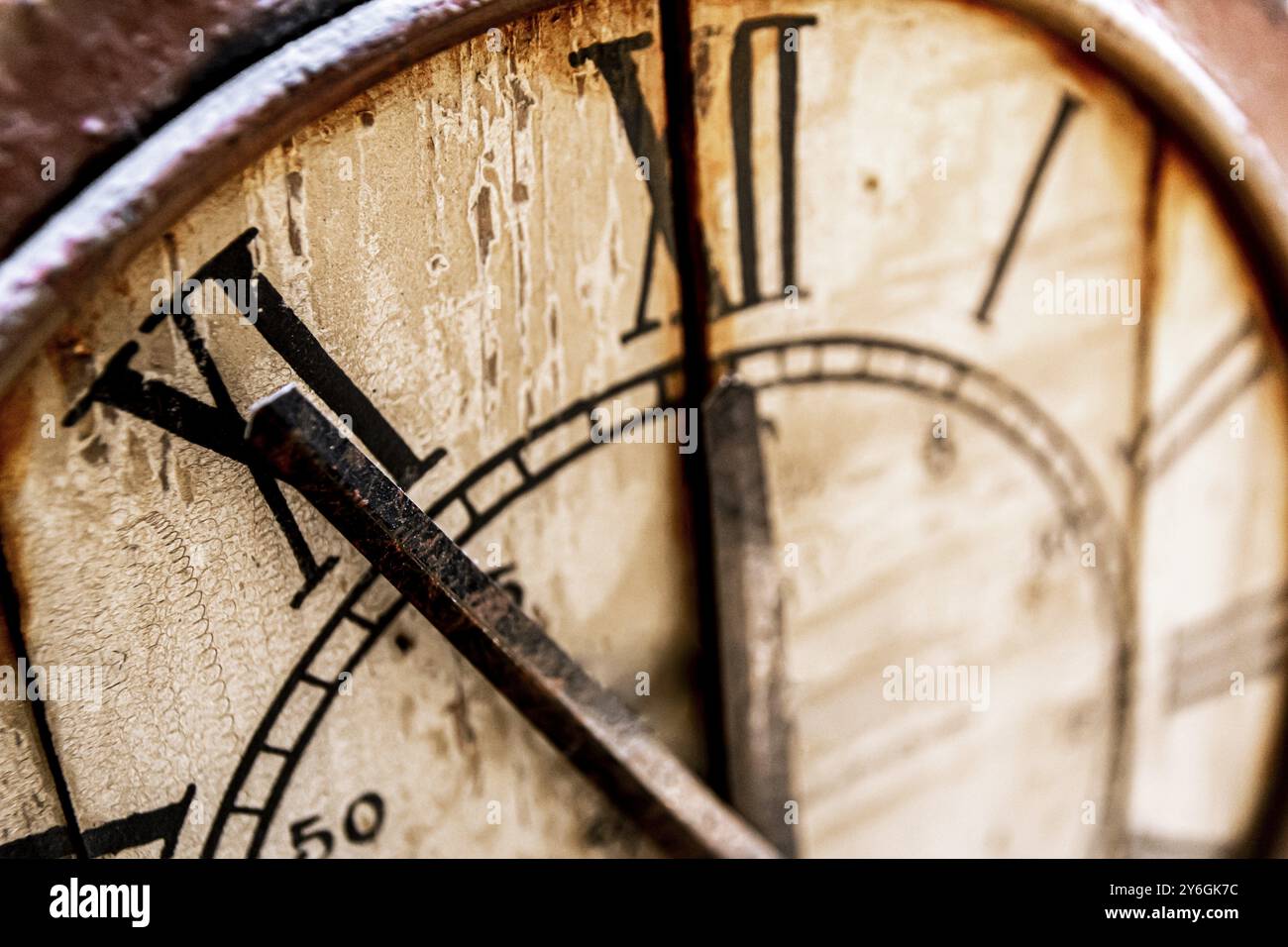 Old vintage and retro analogue clock displaying five minutes to twelve ...