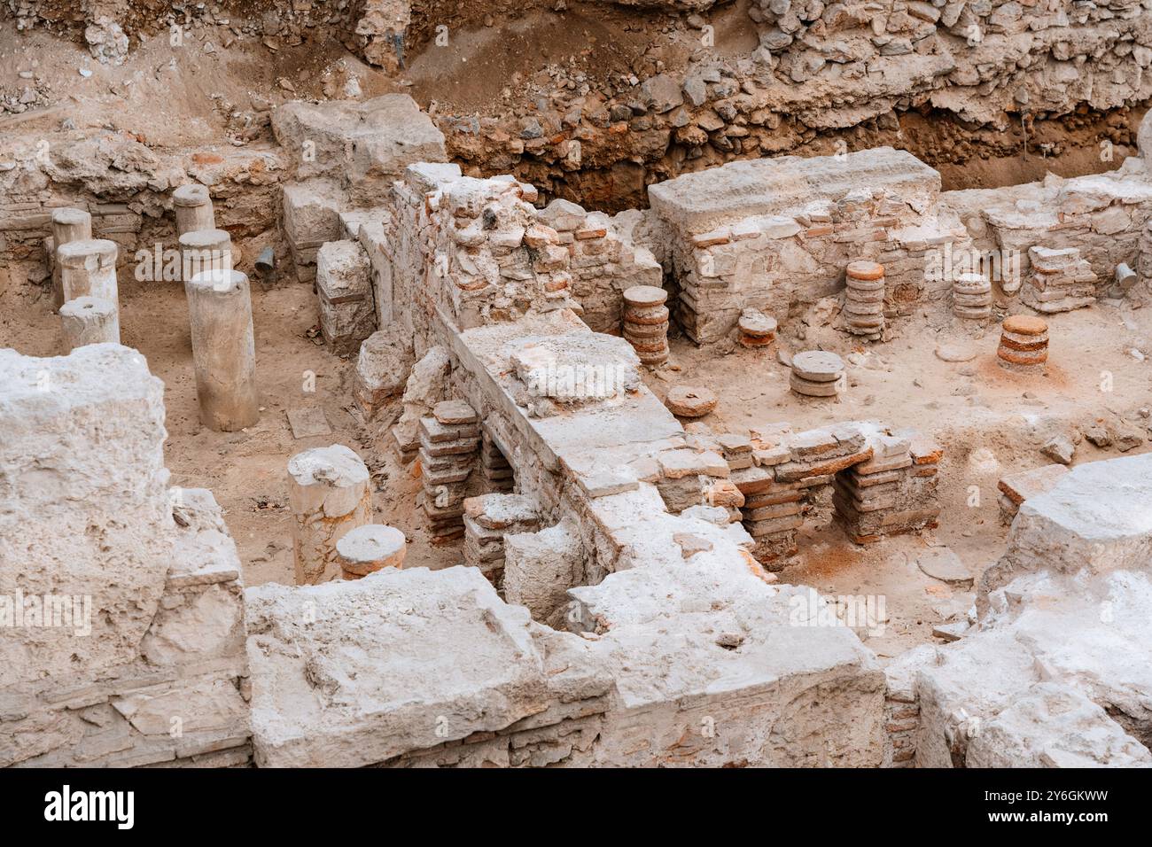 Archaeological excavation site reveals stone columns and brick walls ...
