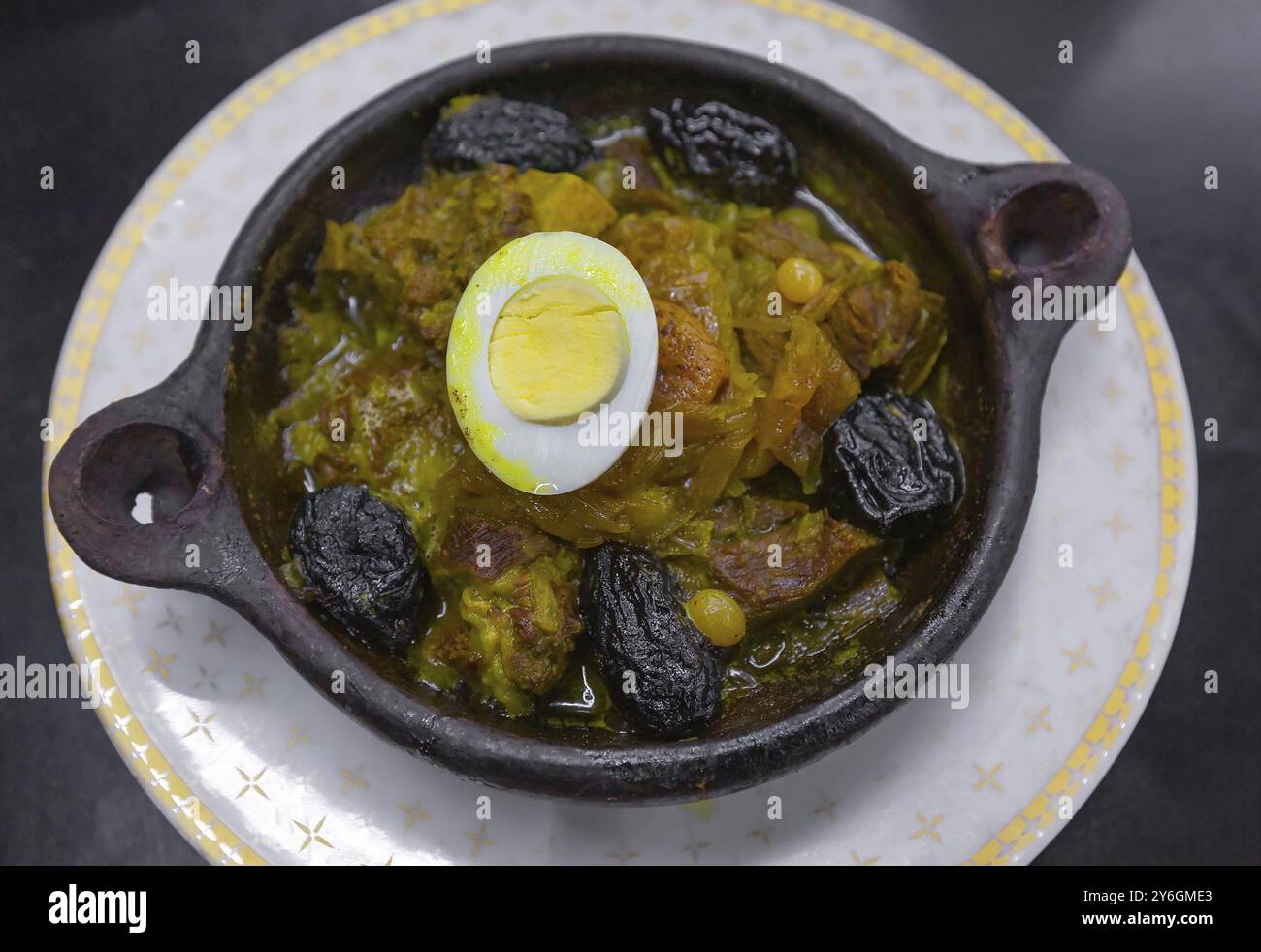 Tajine with meat and prunes in pottery, a traditional dish of Morocco ...
