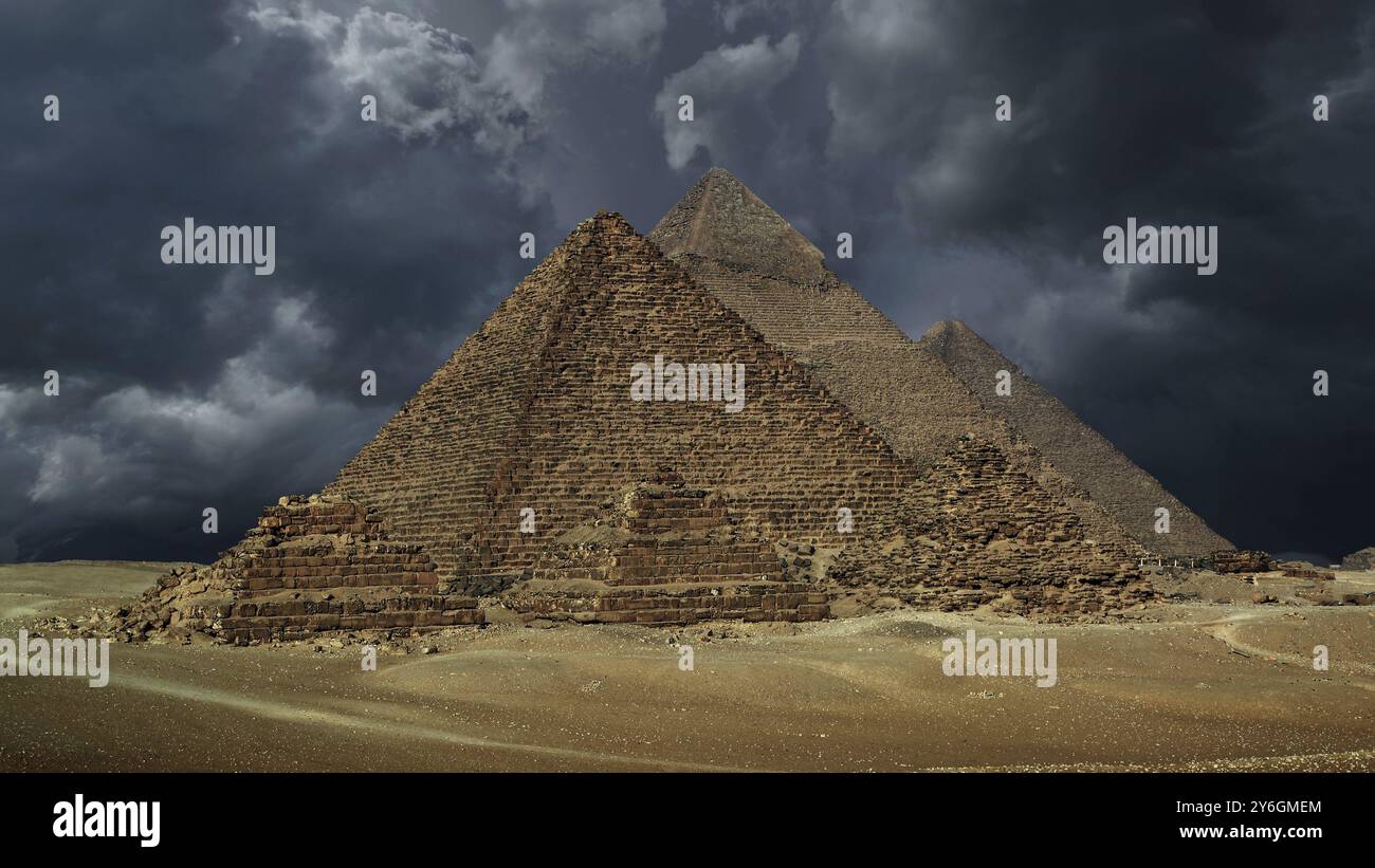 Great pyramids and dark storm clouds in Giza Cairo, Egypt, Africa Stock ...